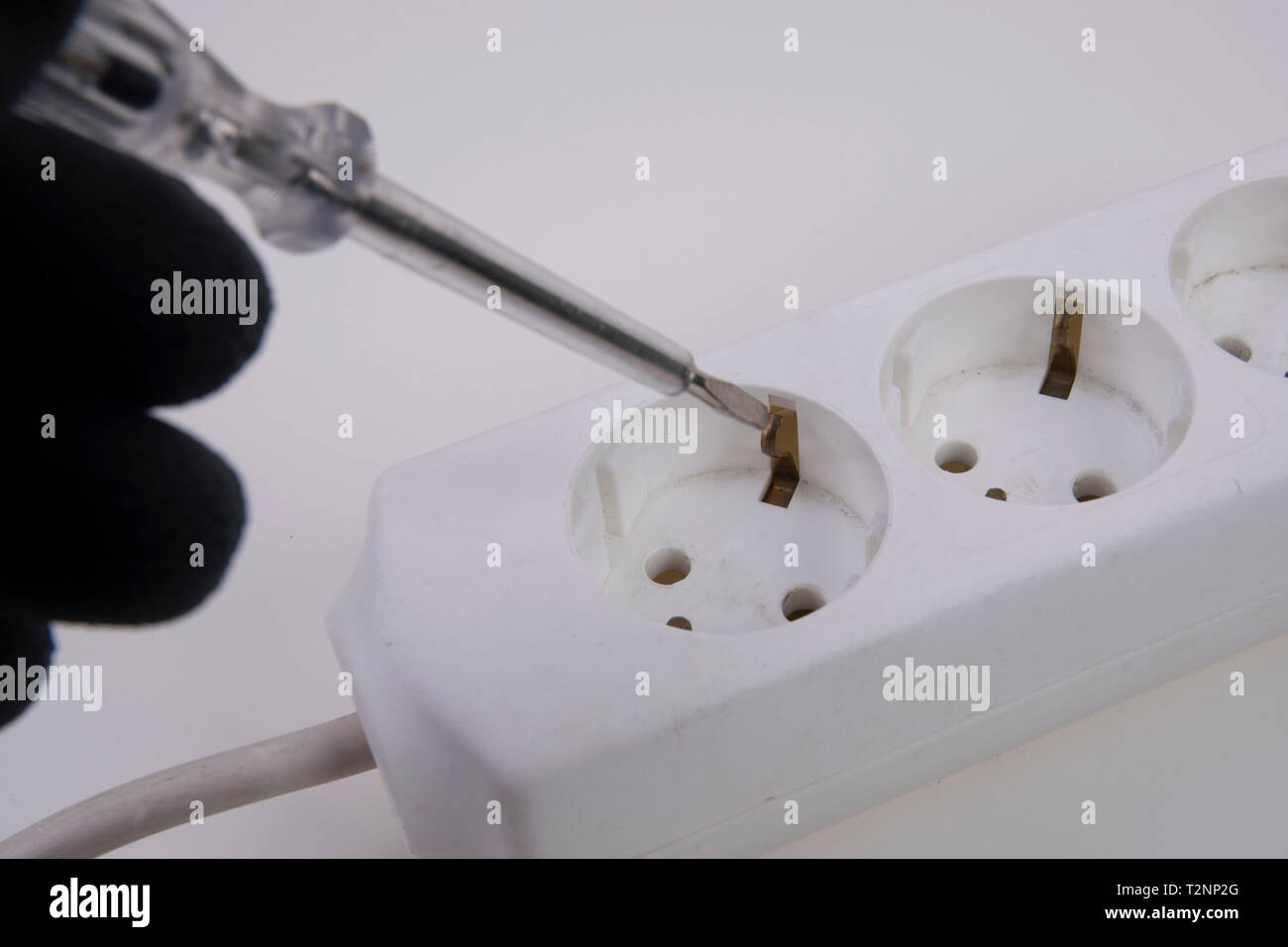 testing energy with voltage tester Stock Photo - Alamy