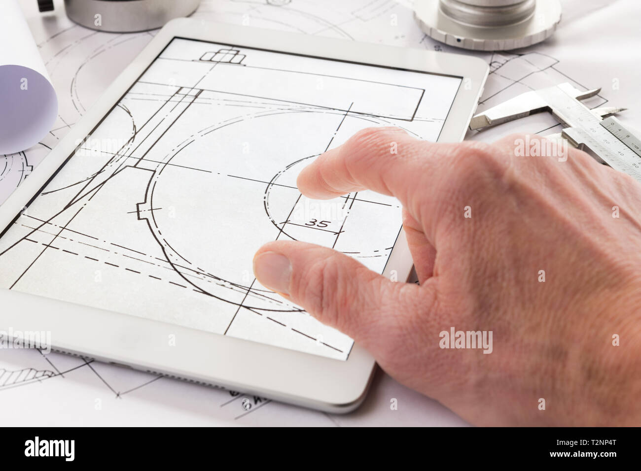 table with tablet computer, Technical drawing, caliper gauge, metal ...