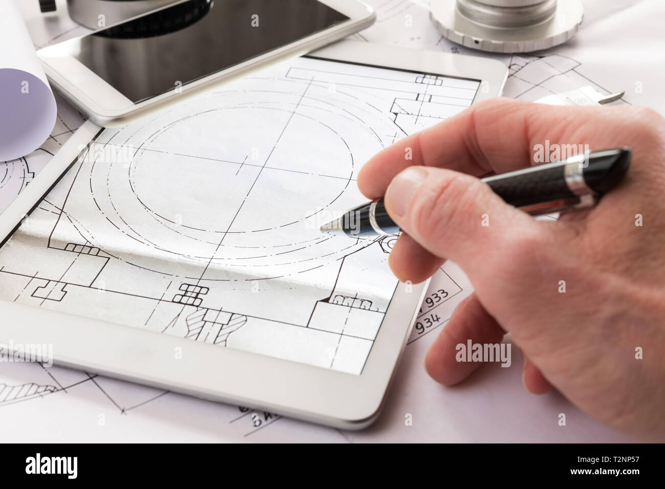 table with tablet computer, Technical drawing, caliper gauge, metal ...