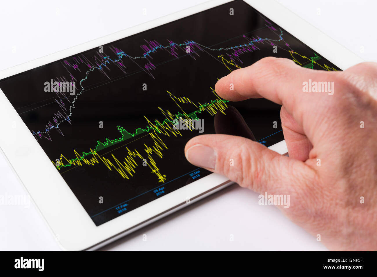 table with tablet computer, graphical diagram Stock Photo - Alamy