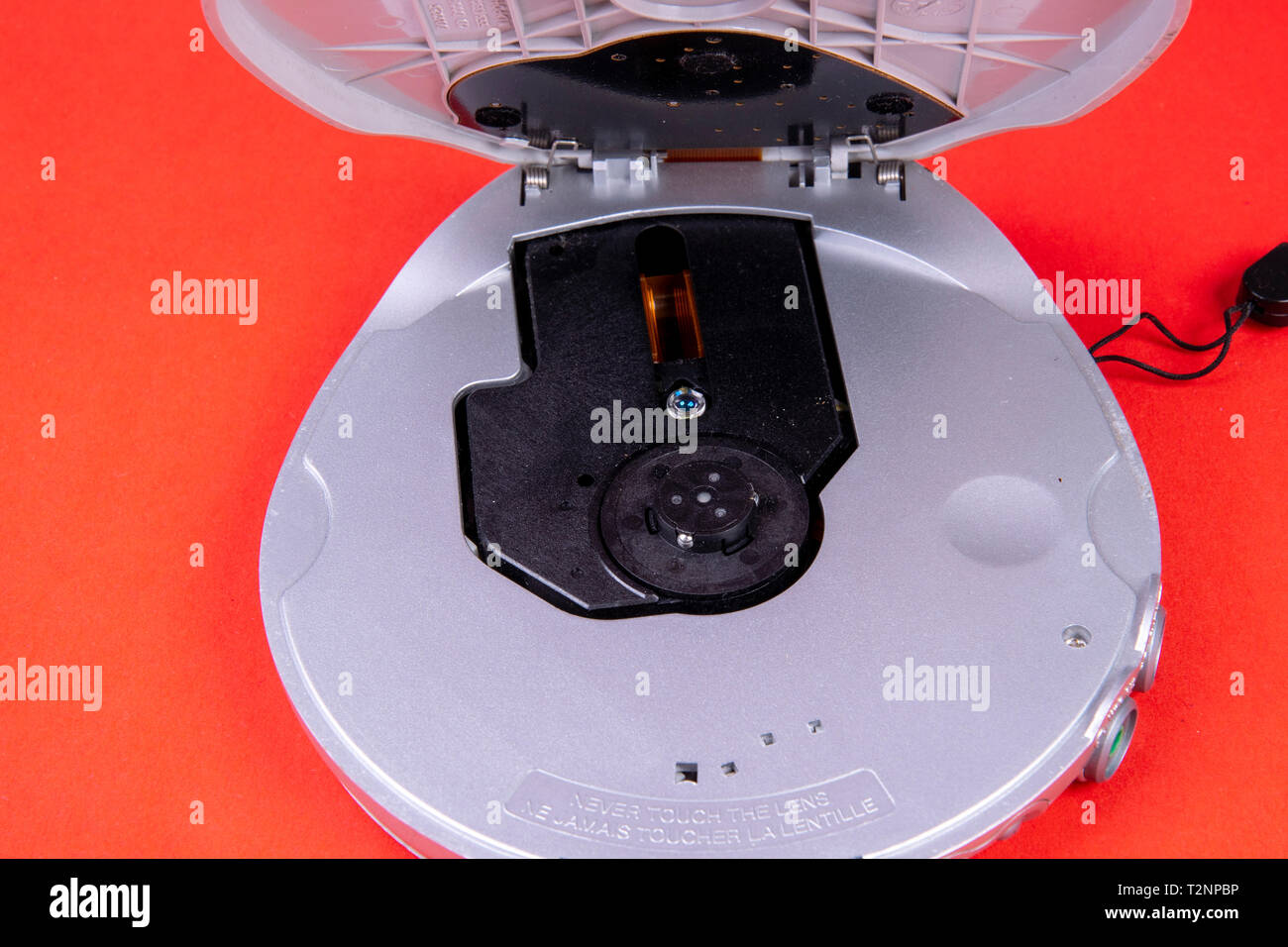 opened retro Discman round on red background Stock Photo - Alamy