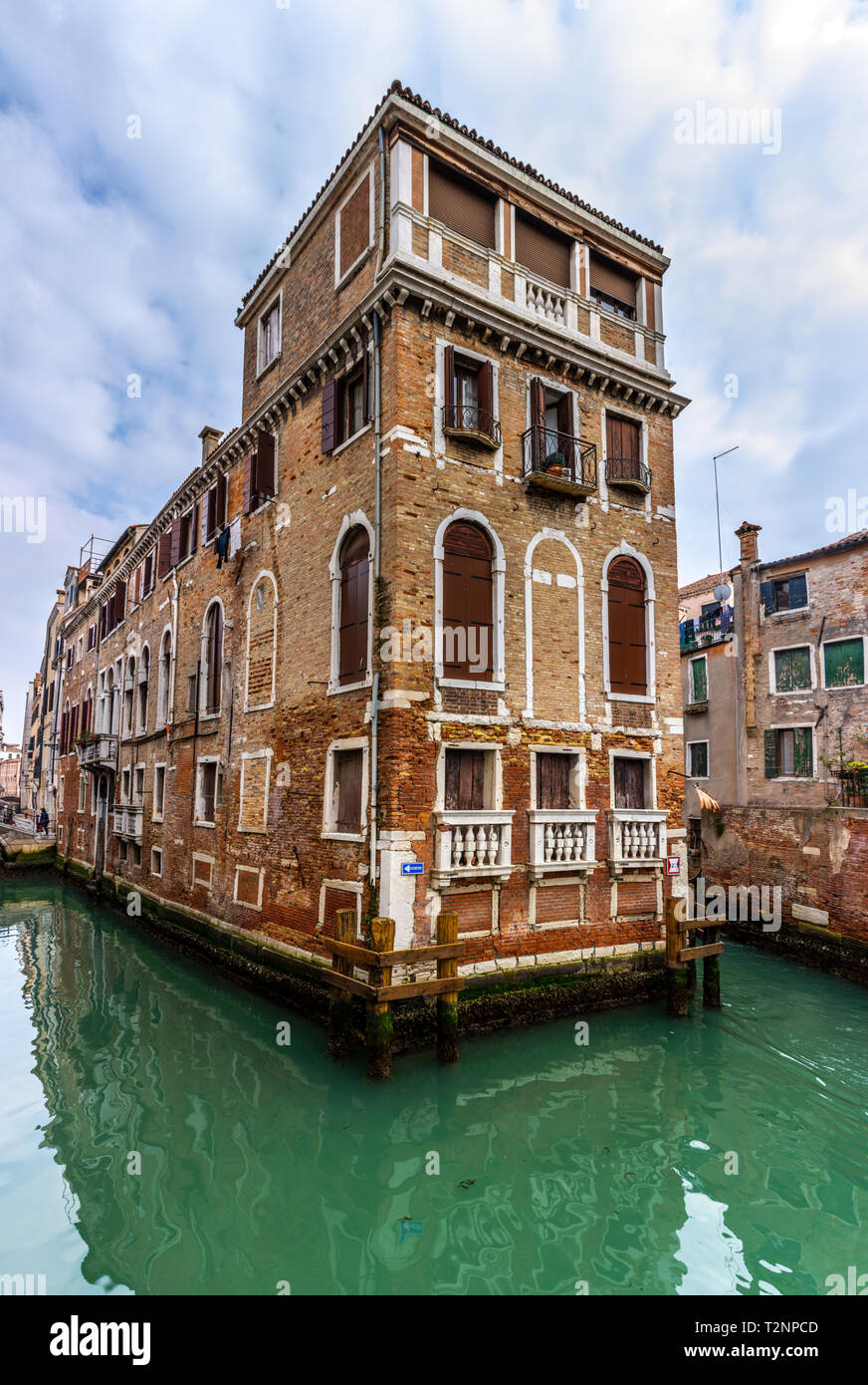 Canal in Venice with traditional old houses, Italy Stock Photo - Alamy