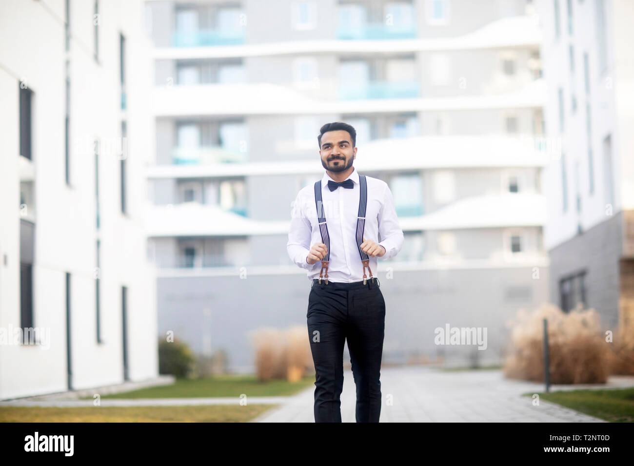 Businessman having walk around residential buildings Stock Photo - Alamy