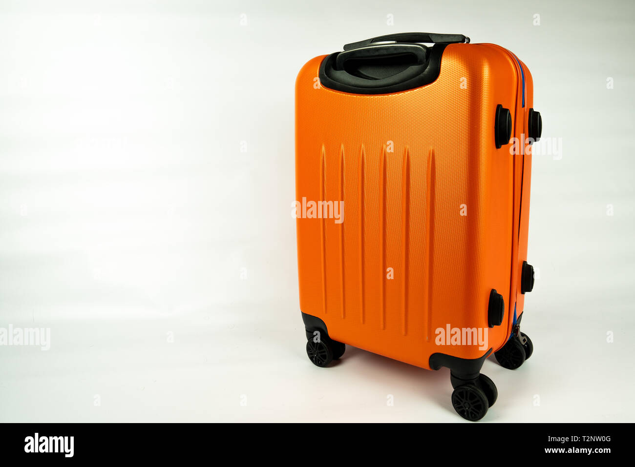 modern orange suitcase. Ready to go for your vacation or business trip ...