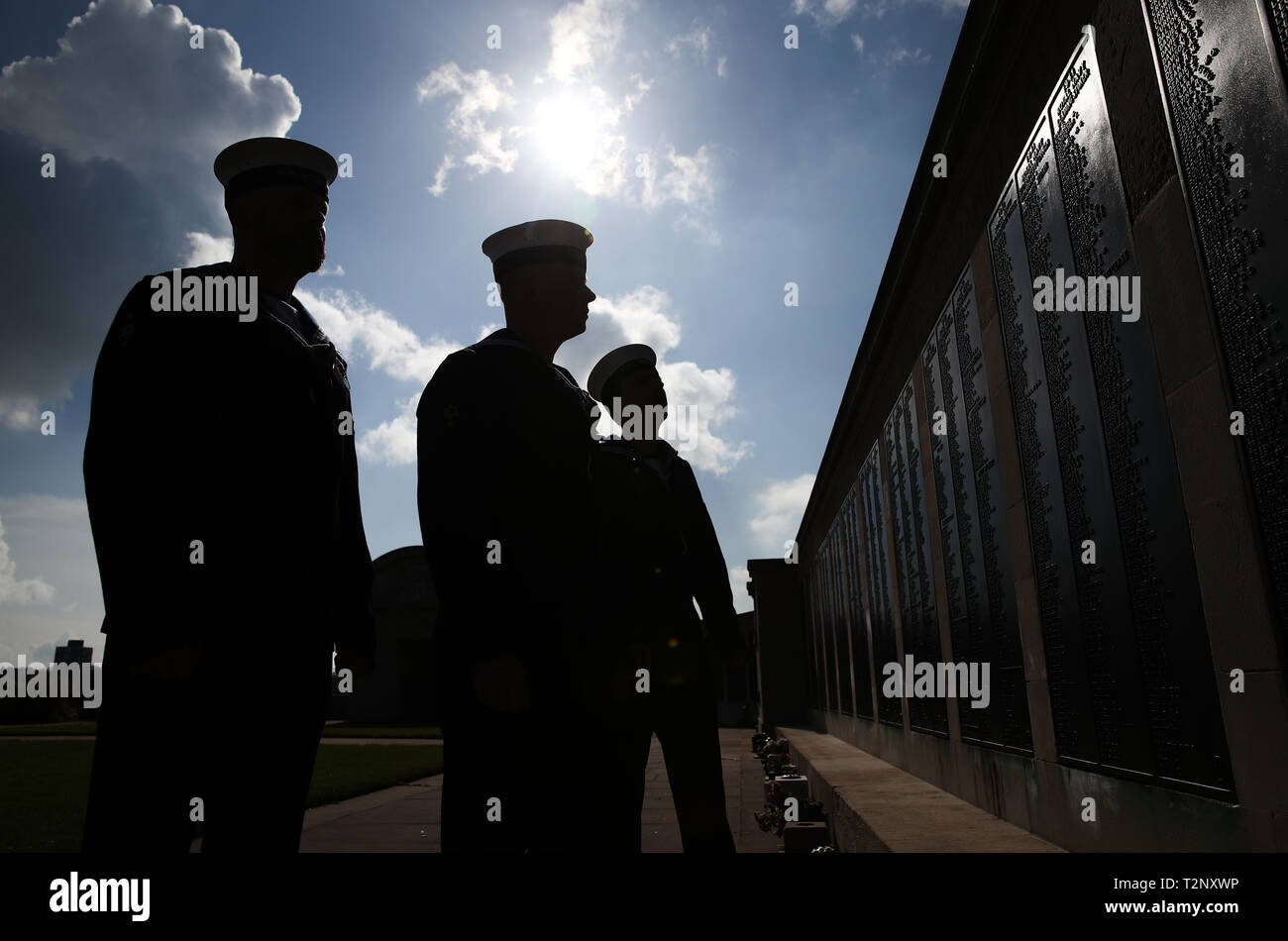 Royal Navy ratings look at the names on one of the panels on the ...