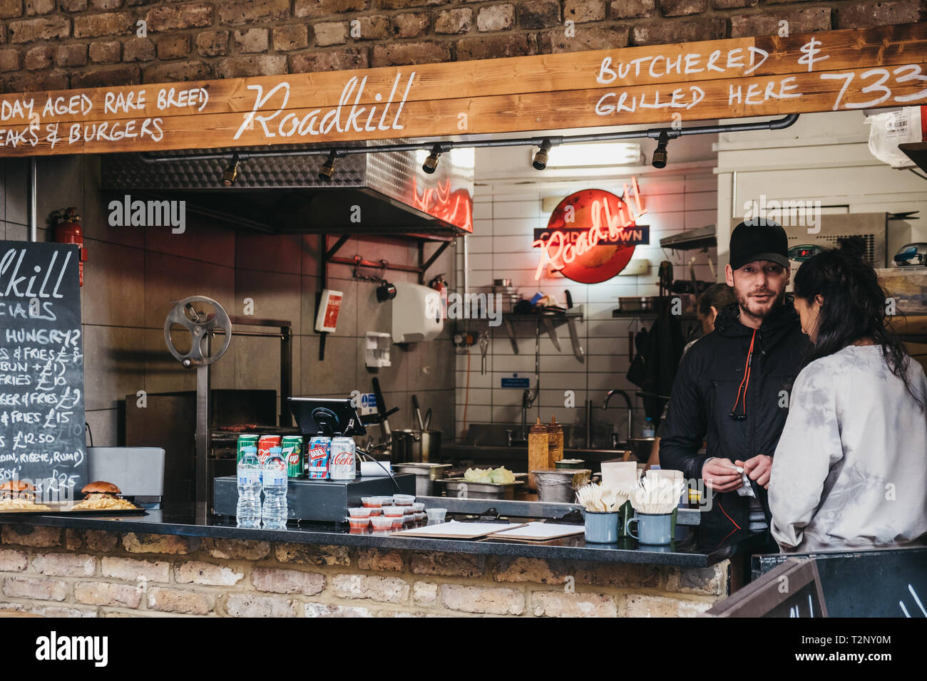 London, UK - March 23,2019: Staff at Roadkill street food stand inside ...