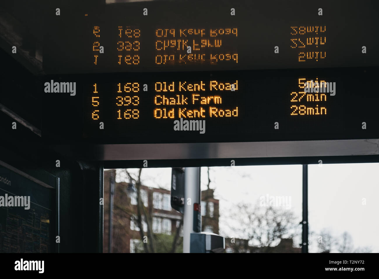 Close up of a upcoming buses schedule on digital screen on a bus stop ...