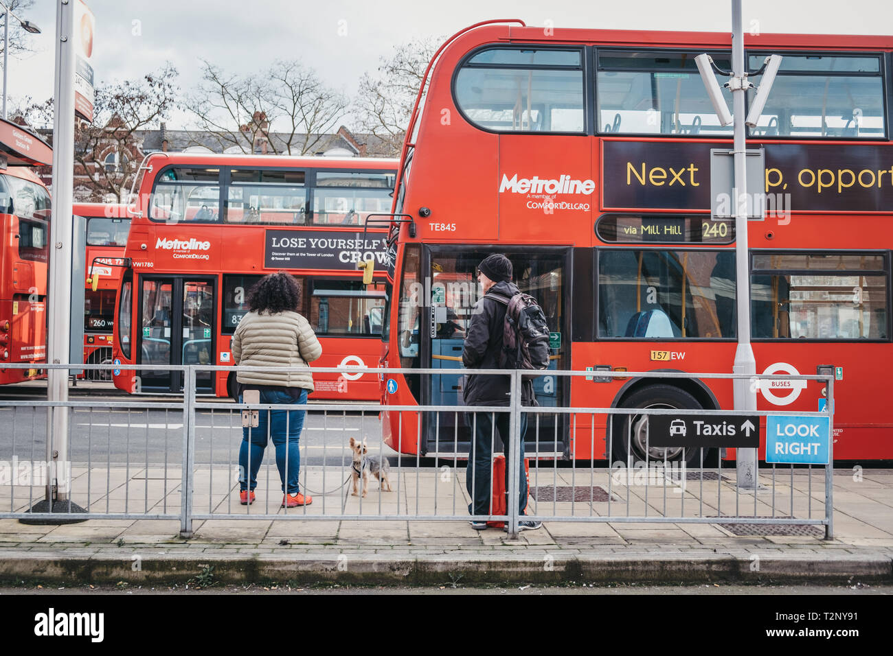 London, UK - March 23, 2019: People waiting for a bus at Golders Green ...