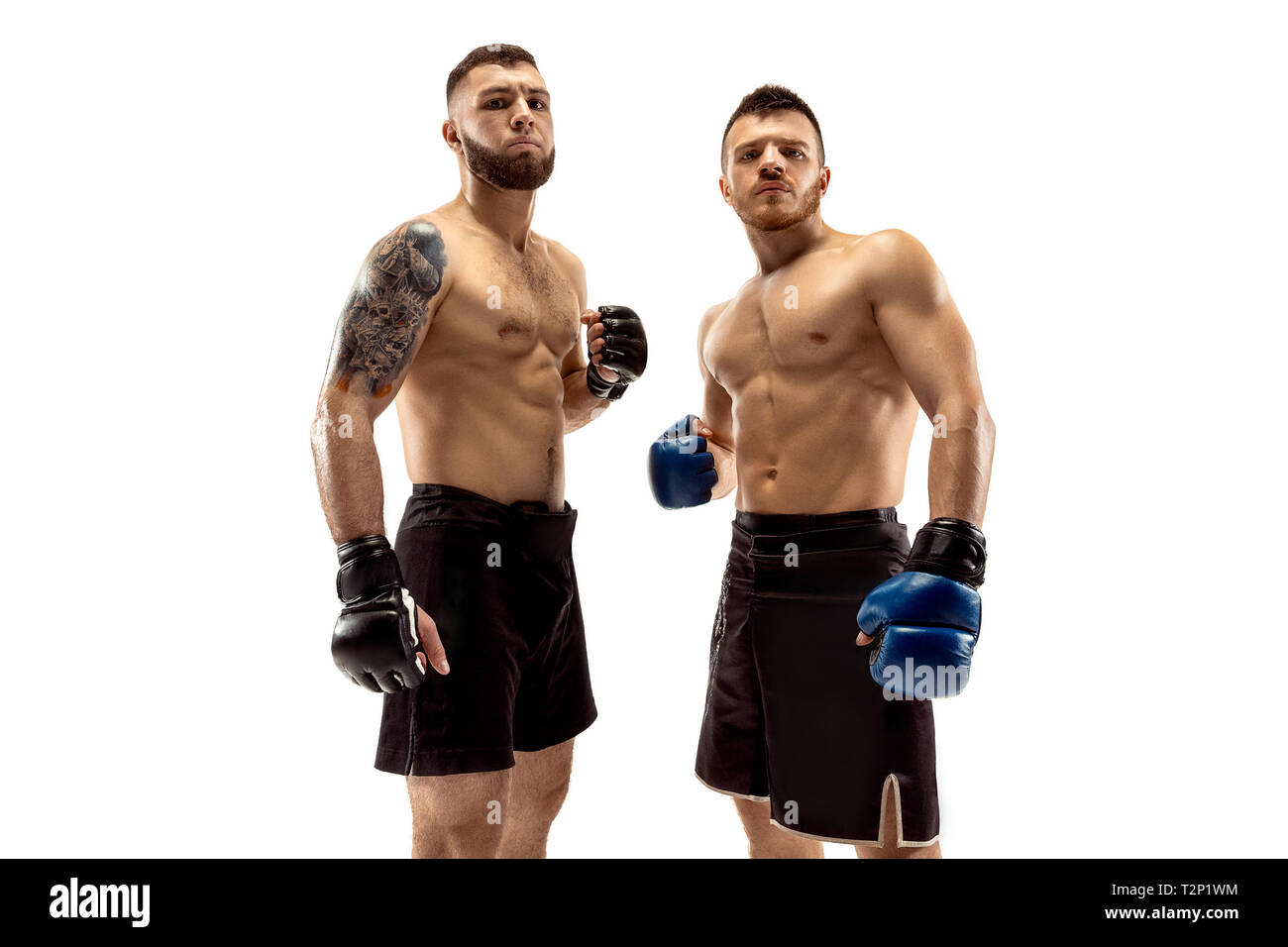 Ready to grow up. Two professional fighters posing isolated on white ...