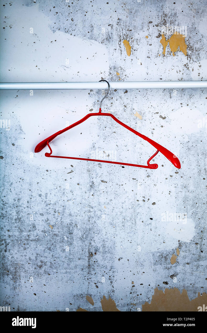 Empty red coat hanger hi-res stock photography and images - Alamy