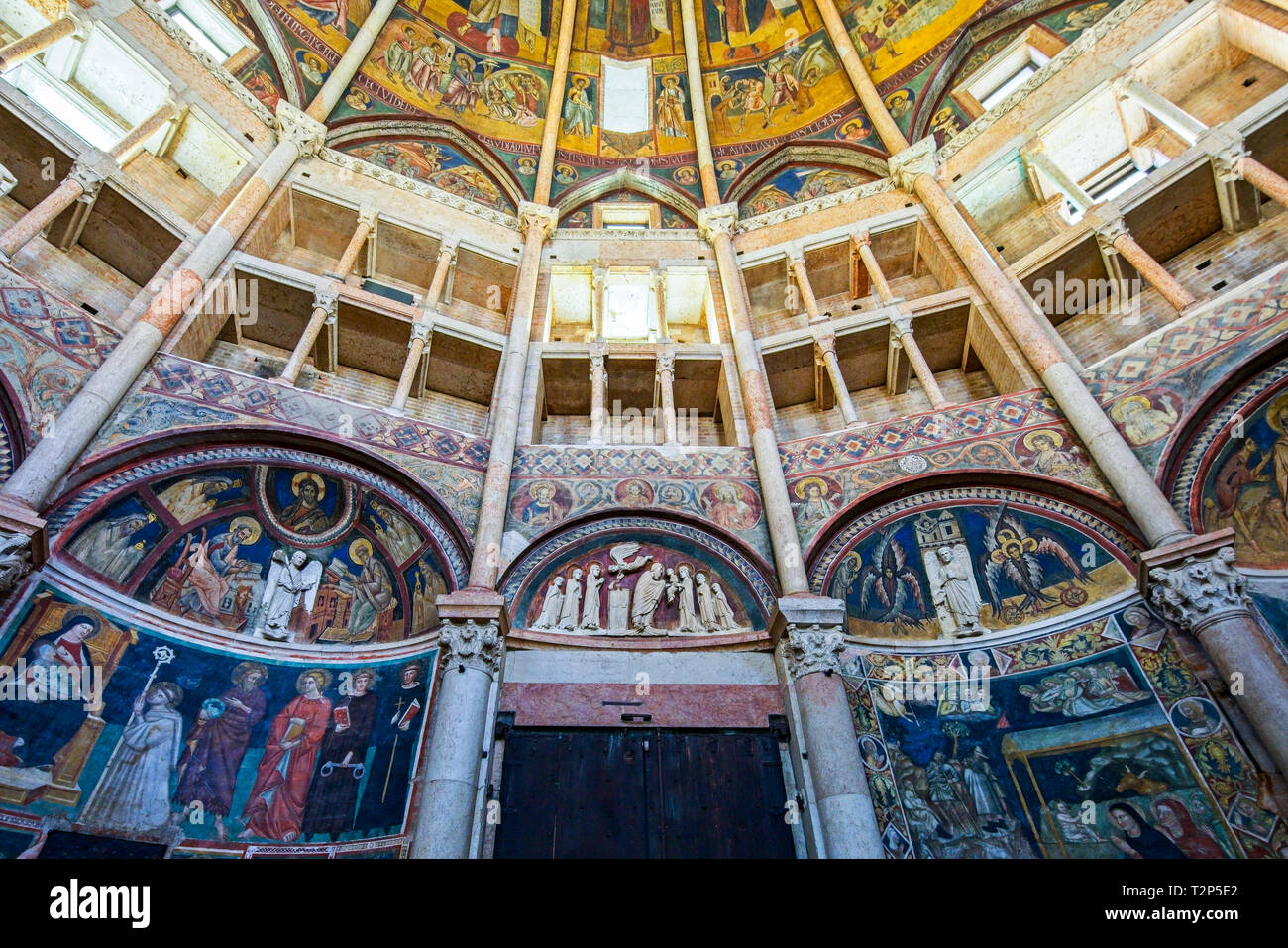 Inside the famous Baptistery of Parma richly decorated by frescoes and ...