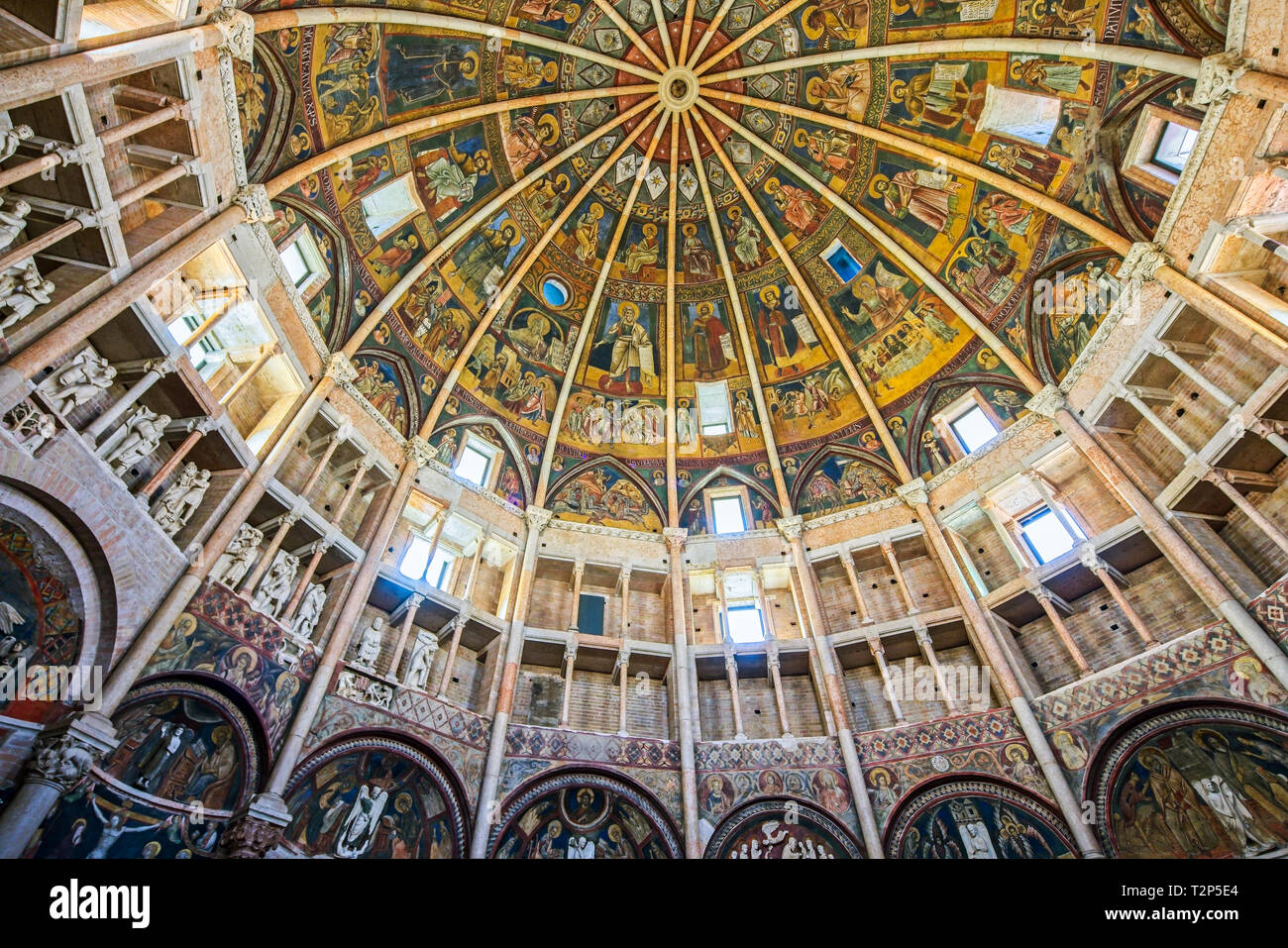 Inside the famous Baptistery of Parma richly decorated by frescoes and ...
