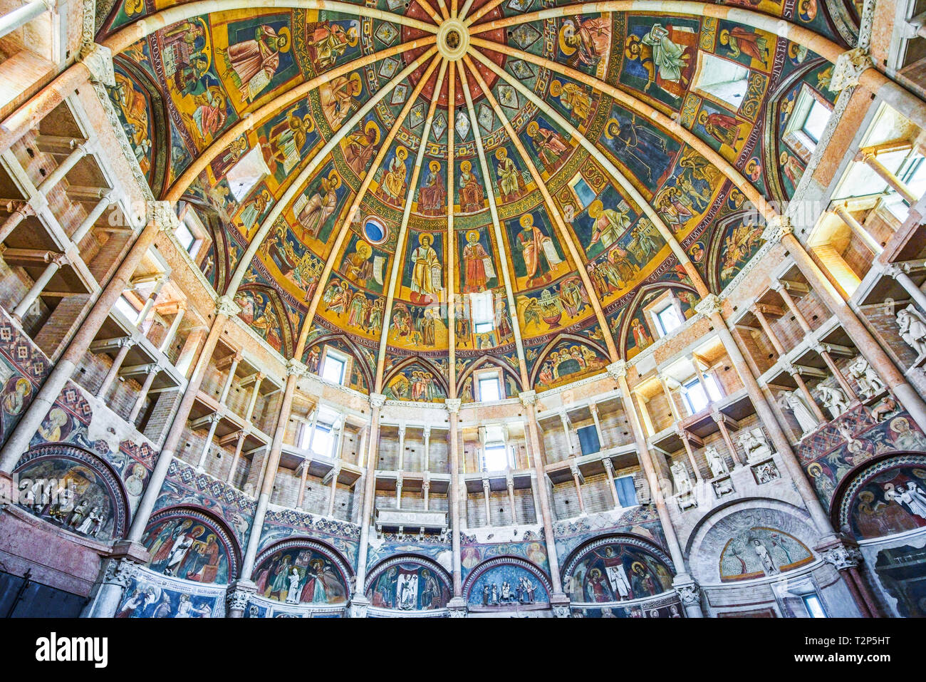 Inside the famous Baptistery of Parma richly decorated by frescoes and ...