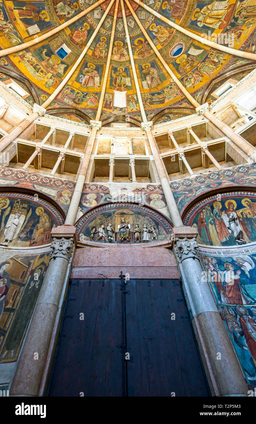 Inside the famous Baptistery of Parma richly decorated by frescoes and ...