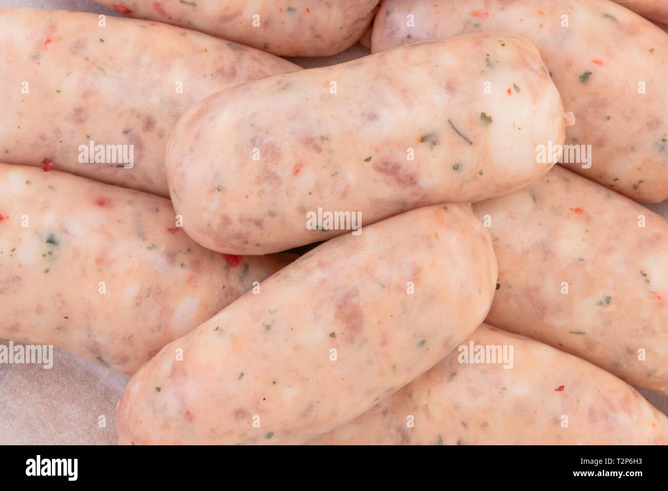 Raw pork sausages texture background, top view Stock Photo - Alamy