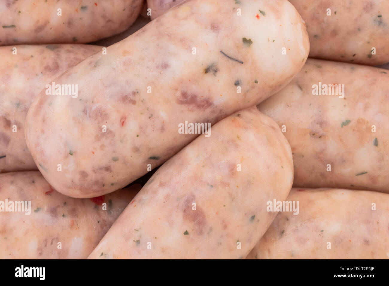 Raw pork sausages texture background, top view Stock Photo - Alamy