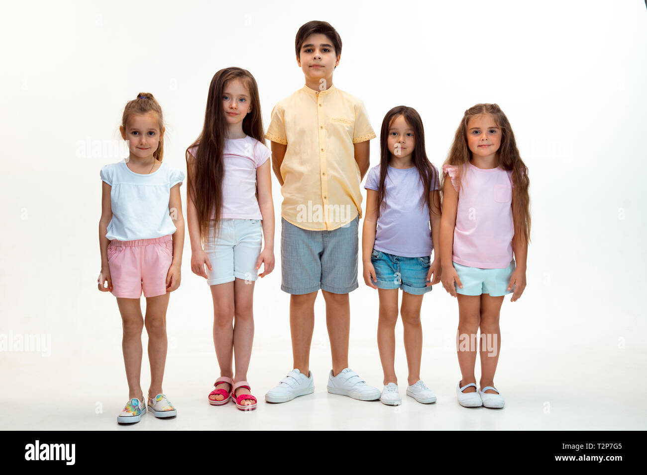 The portrait of happy cute little kids boy and girls in stylish casual ...