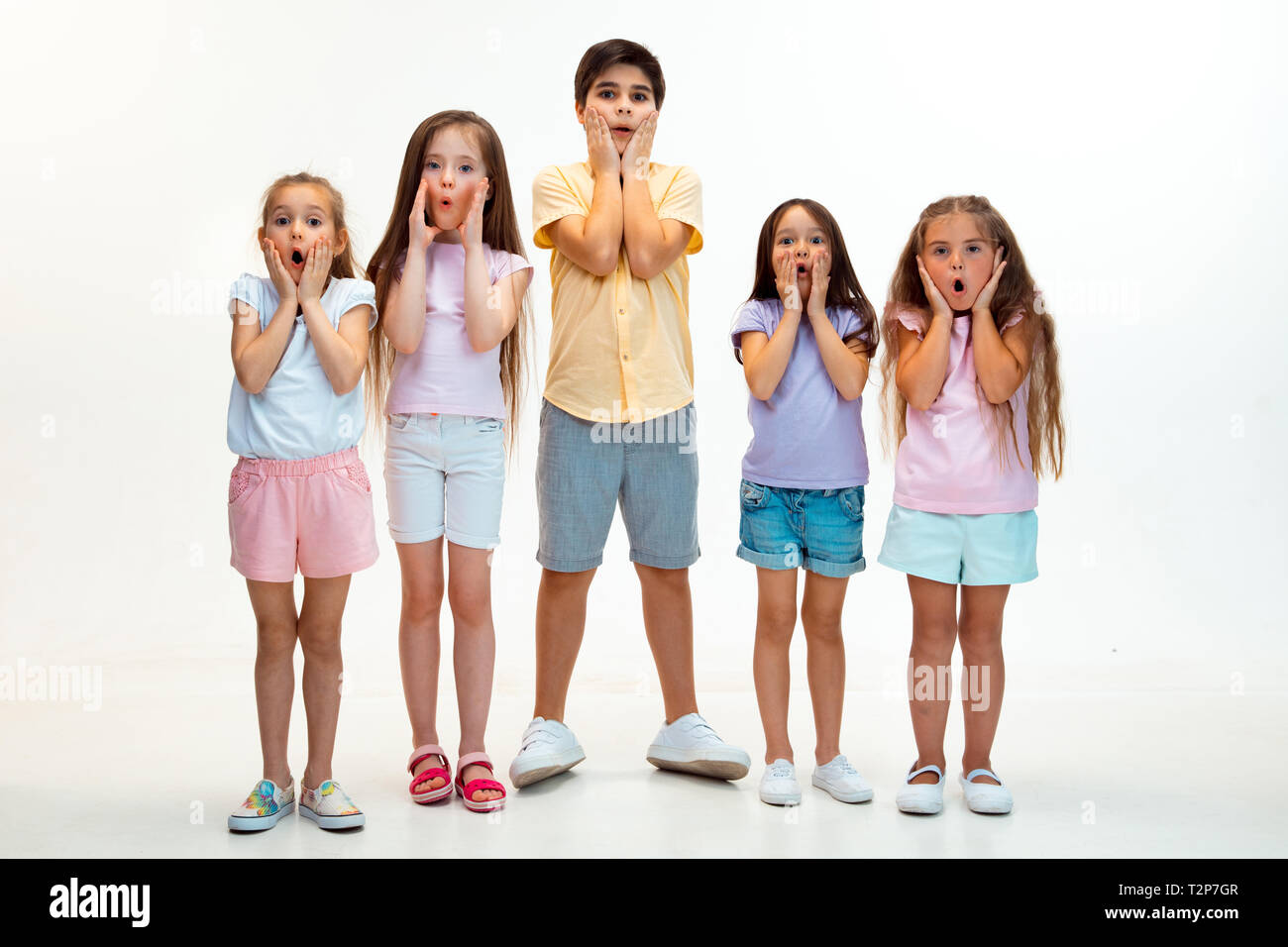 The portrait of happy cute little kids boy and girls in stylish casual ...