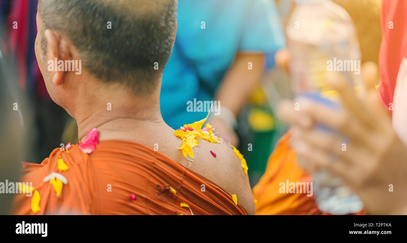 People pouring water to Buddhist Monk and gives blessing in Thailand ...