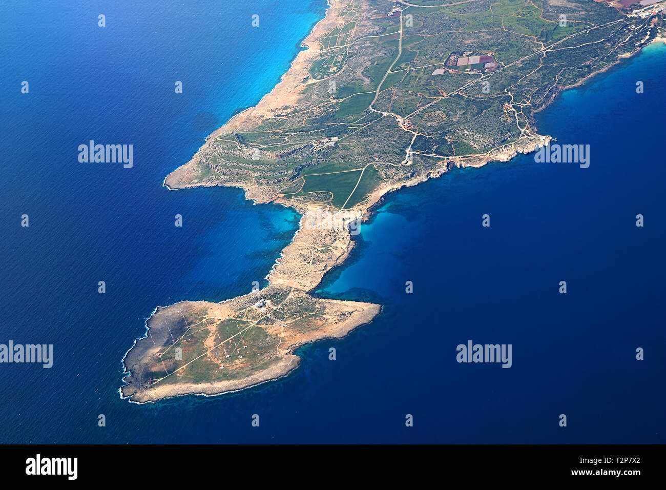 View from an airplane of island of Cyprus. Seacoast line with blue ...