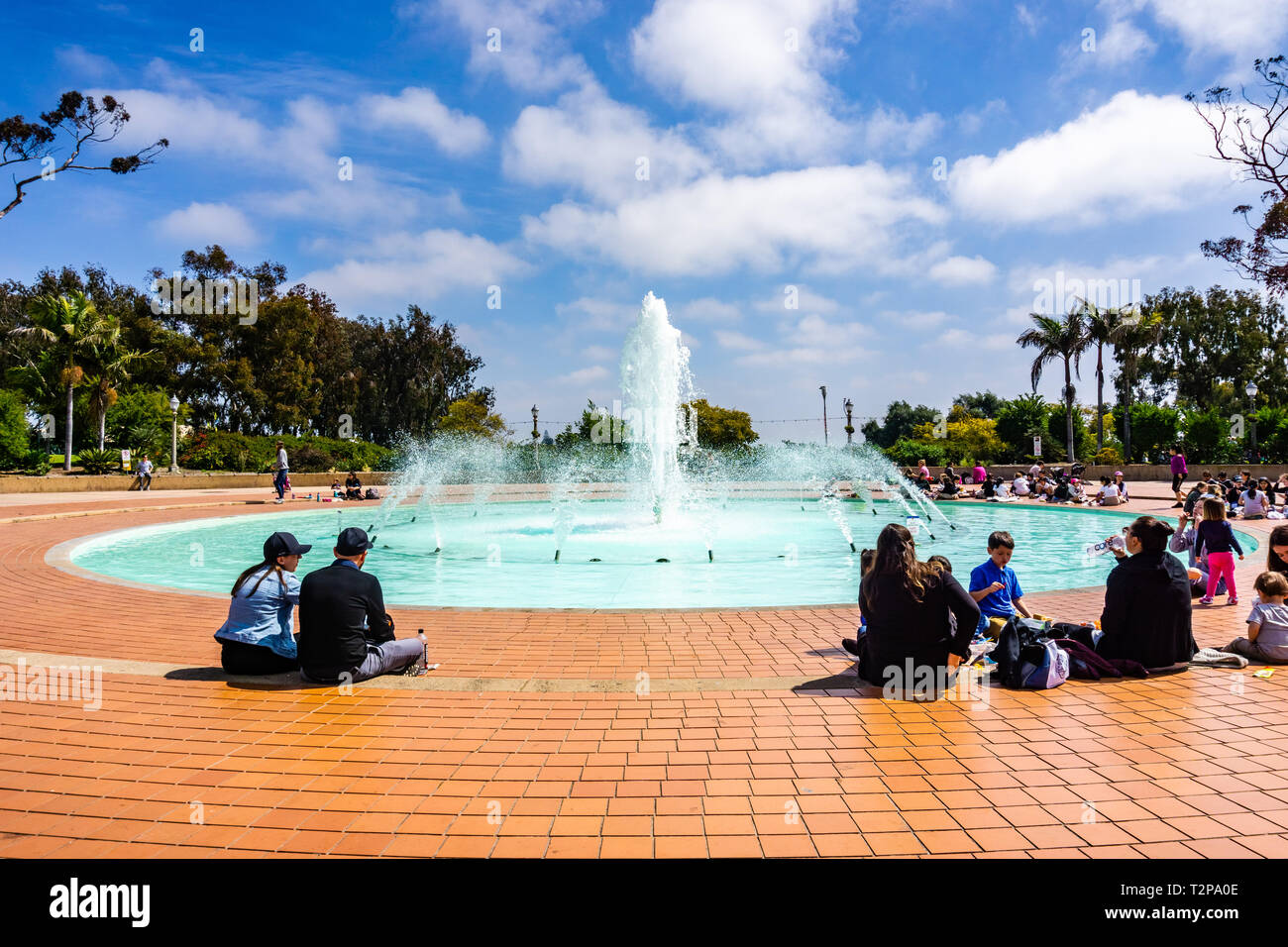 People Sitting Around Water Fountain High Resolution Stock Photography ...