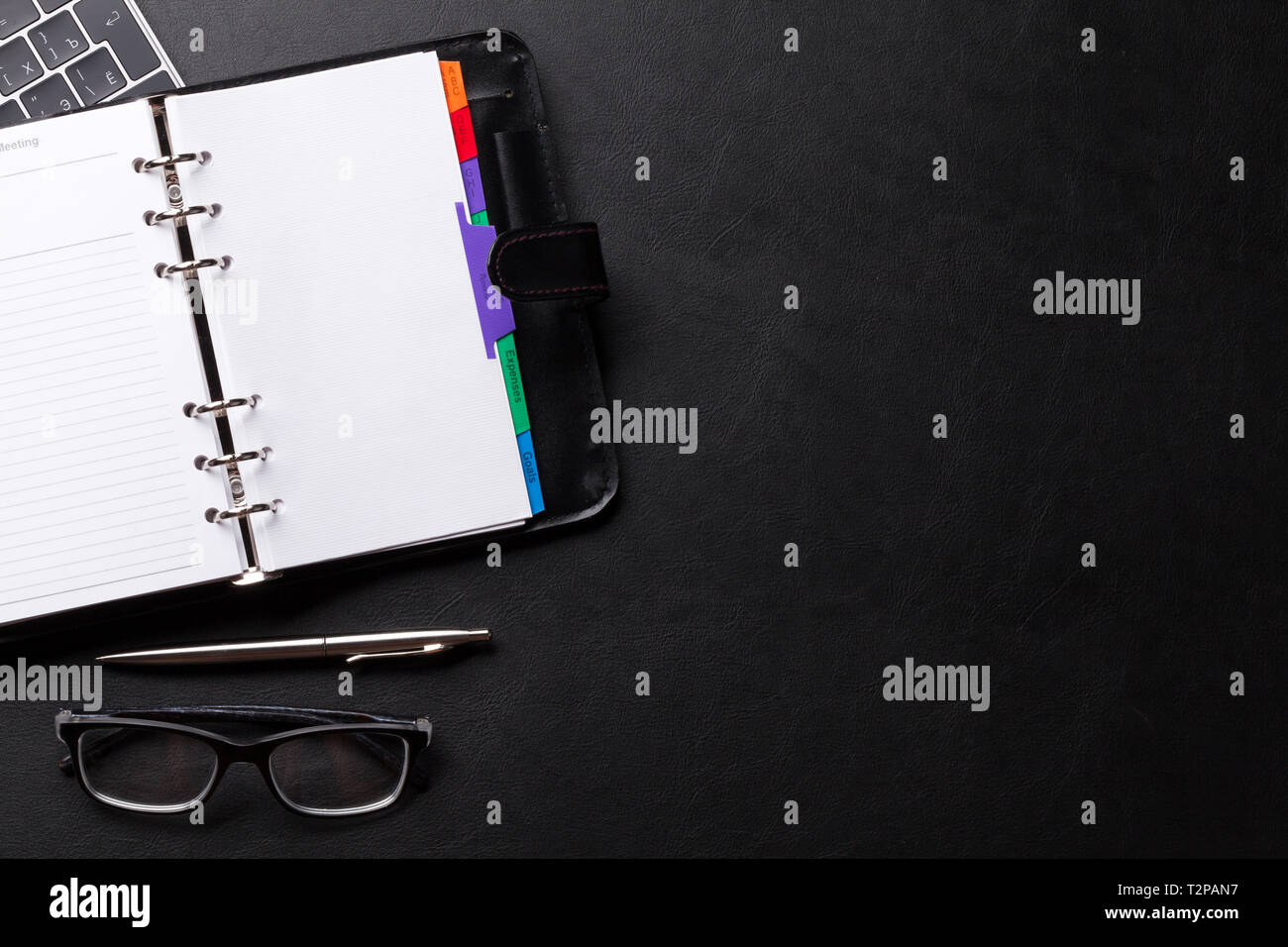 Office workplace table with notepad and laptop. Flat lay. Top view with ...