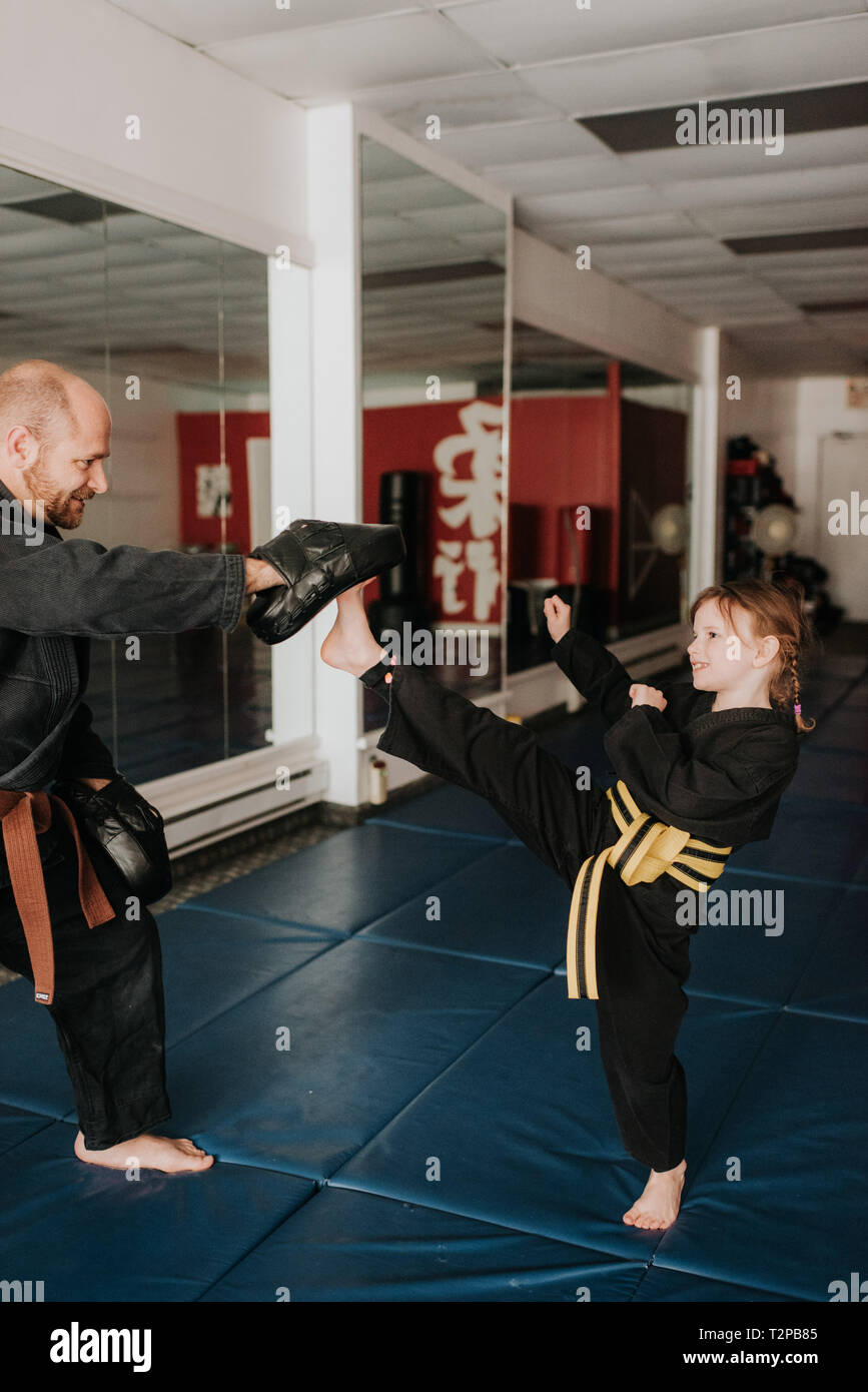 Coach and student practising kickboxing in studio Stock Photo - Alamy