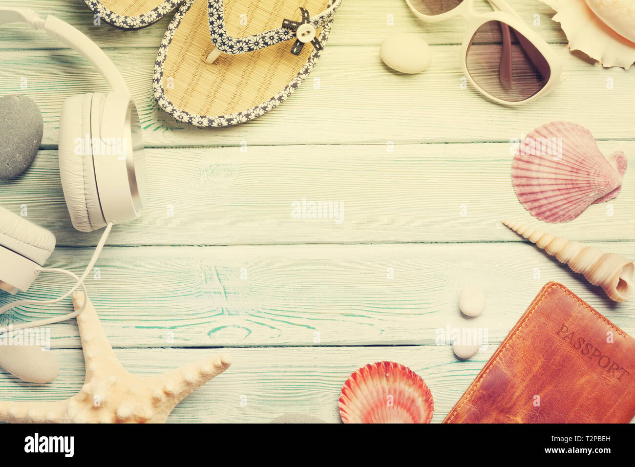 Travel vacation table concept with sunglasses, headphones, passport and ...