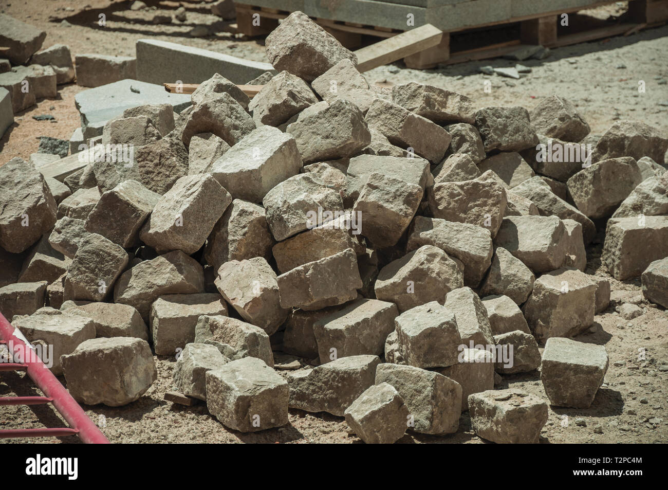 Close-up of setts stones pile in a construction site of street being ...