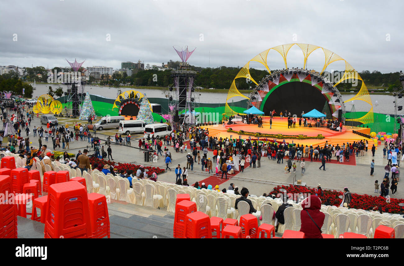 Dalat, Vietnam - December 24th 2017. People watch the main stage as ...