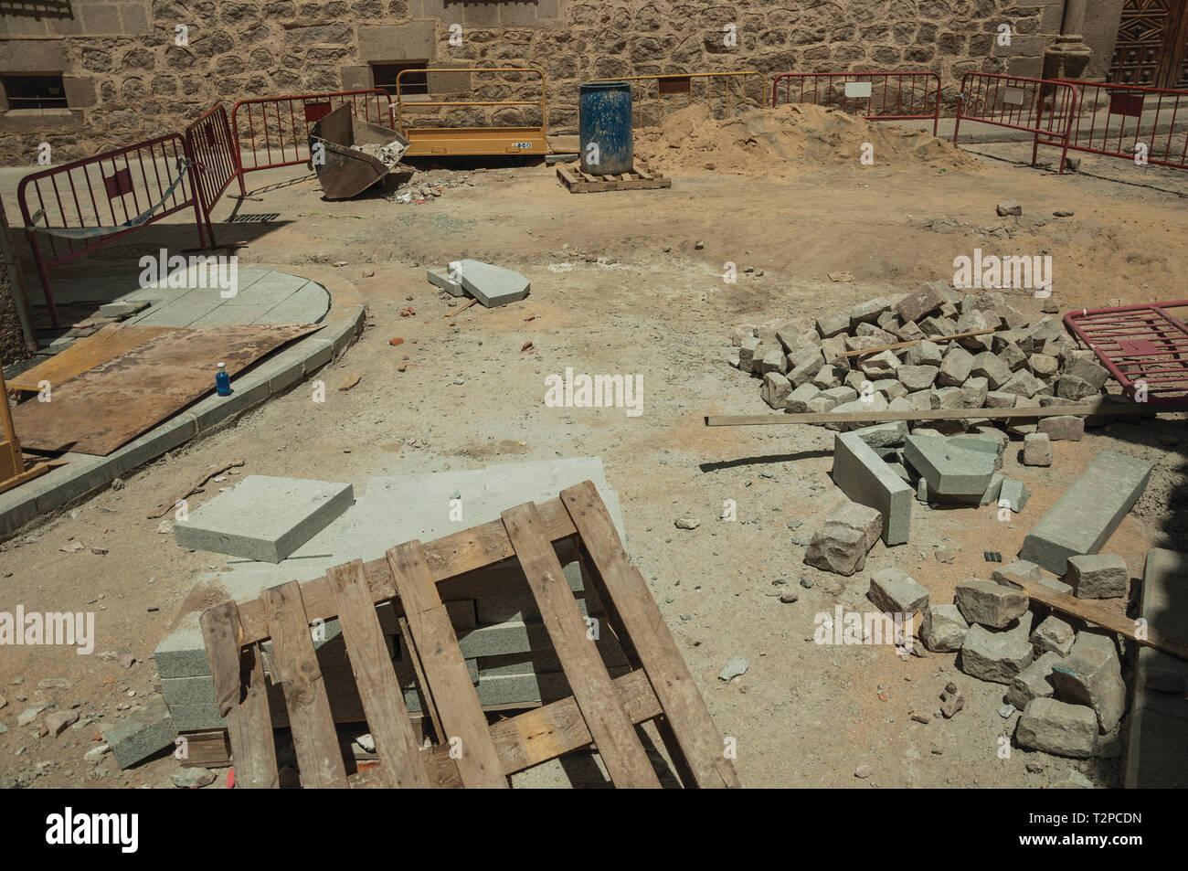 Piles of stones and rubble in a construction site of street being ...