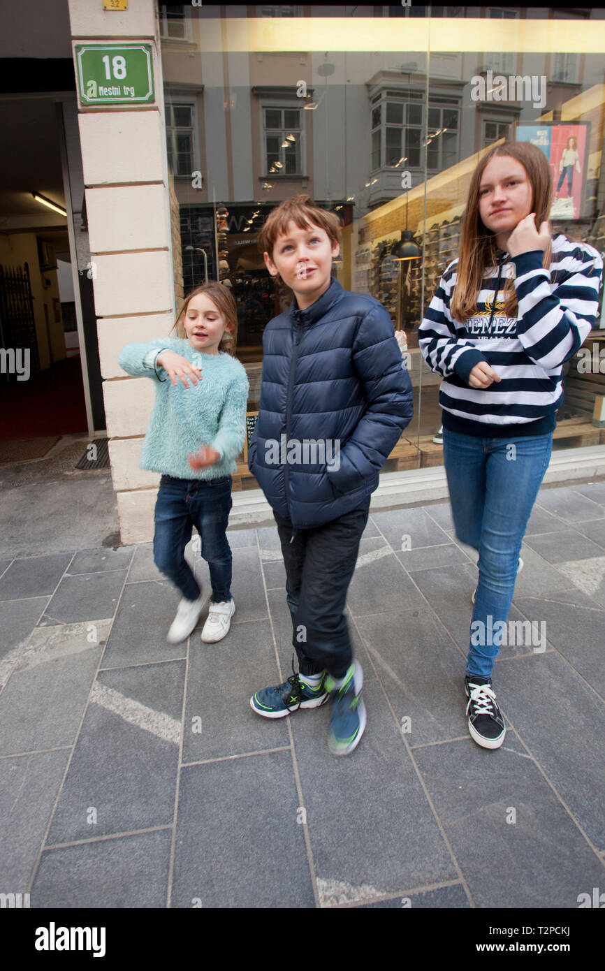 Children On Street Outside Shop High Resolution Stock Photography and ...