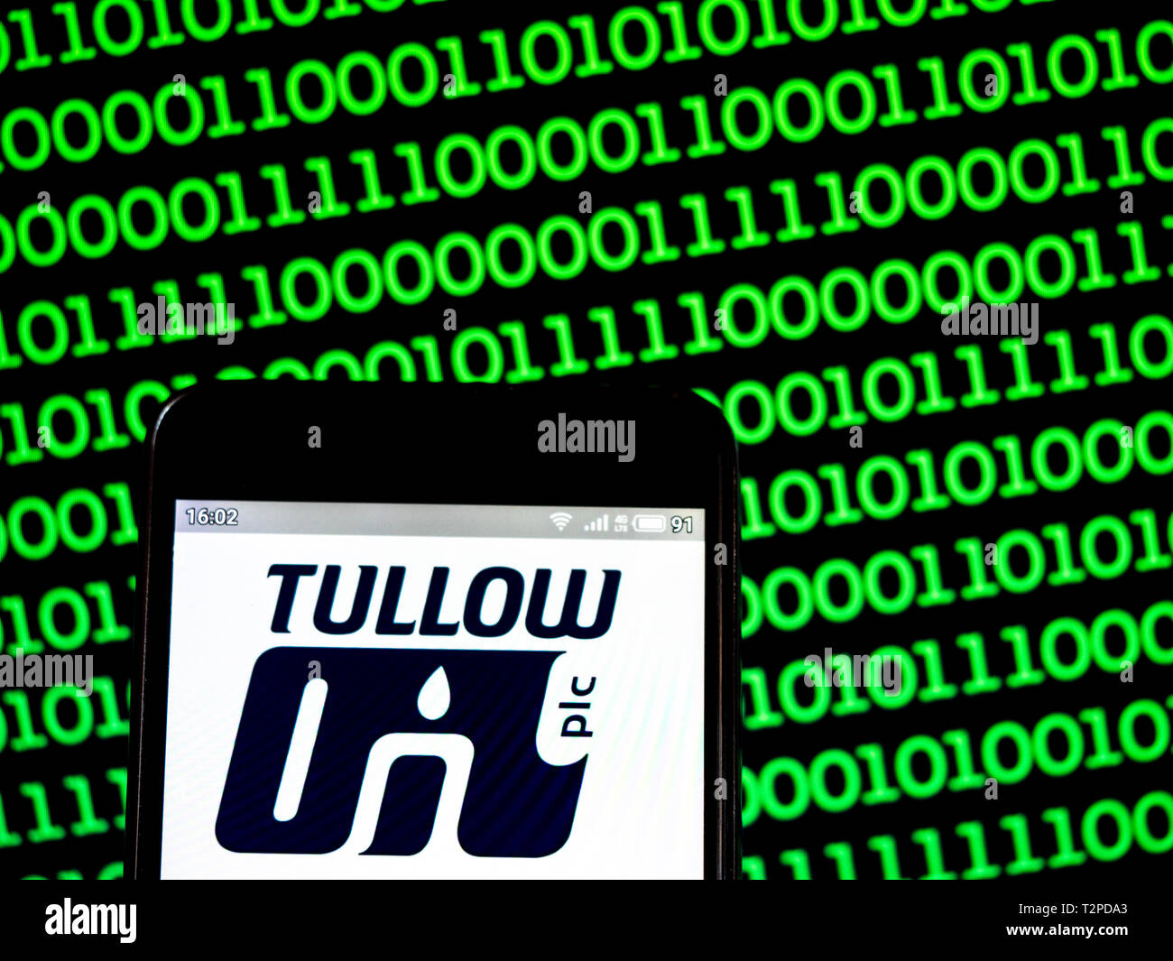 In this photo illustration a Tullow Oil plc logo seen displayed on a ...