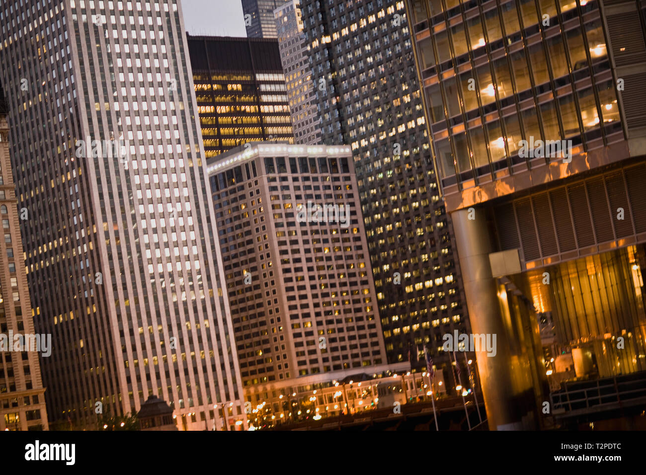 High-rise buildings with illuminated windows in the city at dusk Stock ...