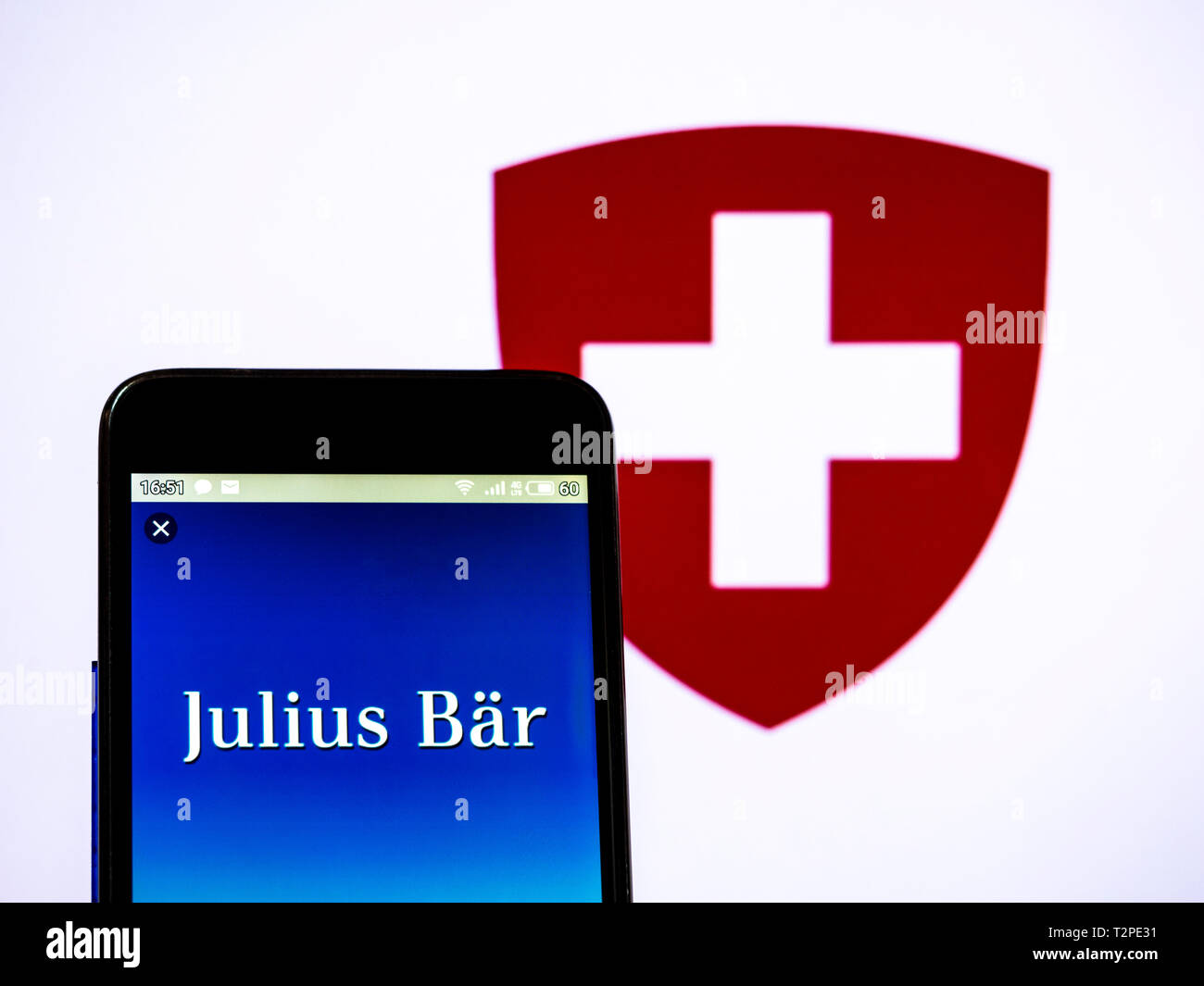 In this photo illustration a Julius Bar Group logo seen displayed on a ...