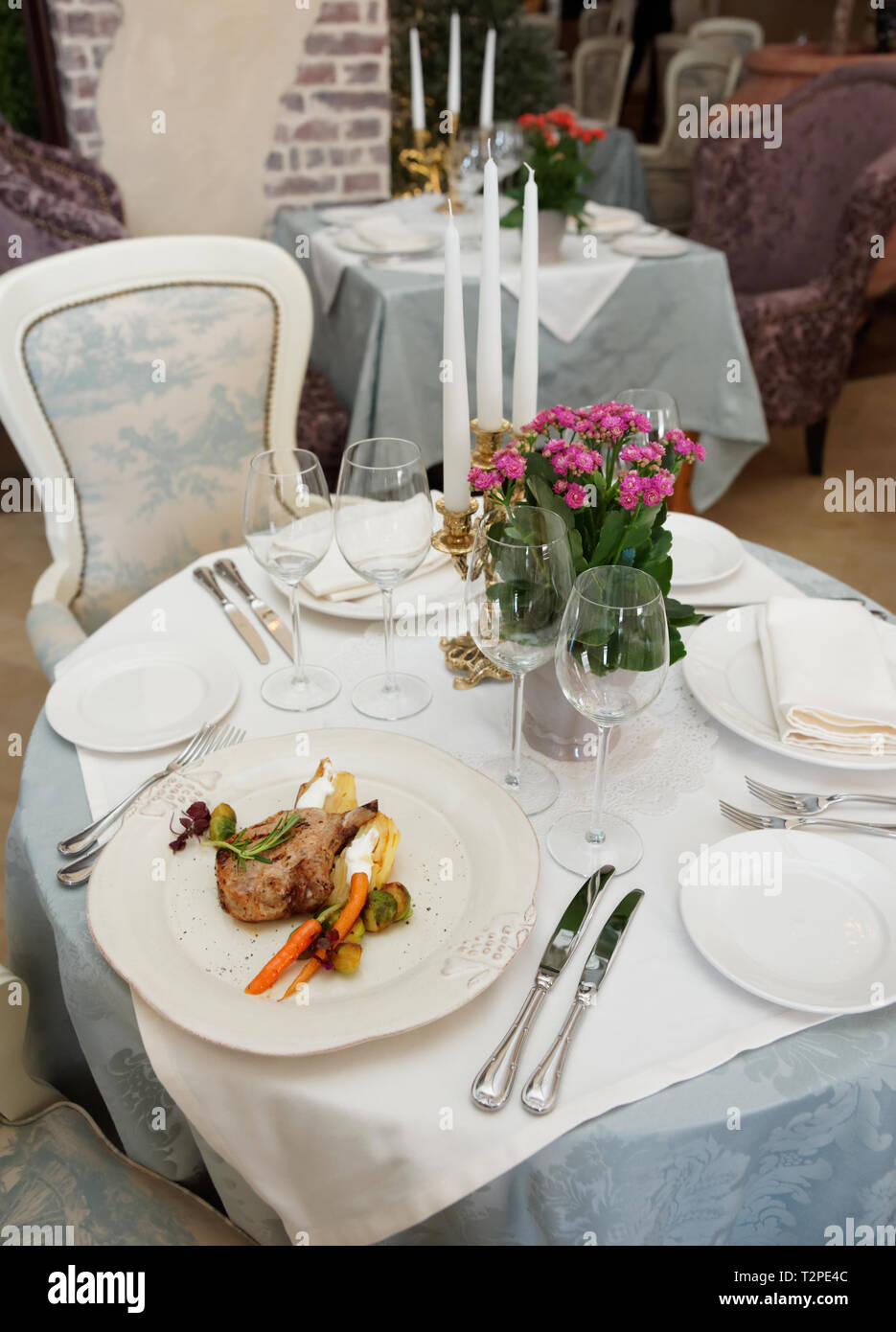 Set table in a stylish expensive restaurant Stock Photo - Alamy