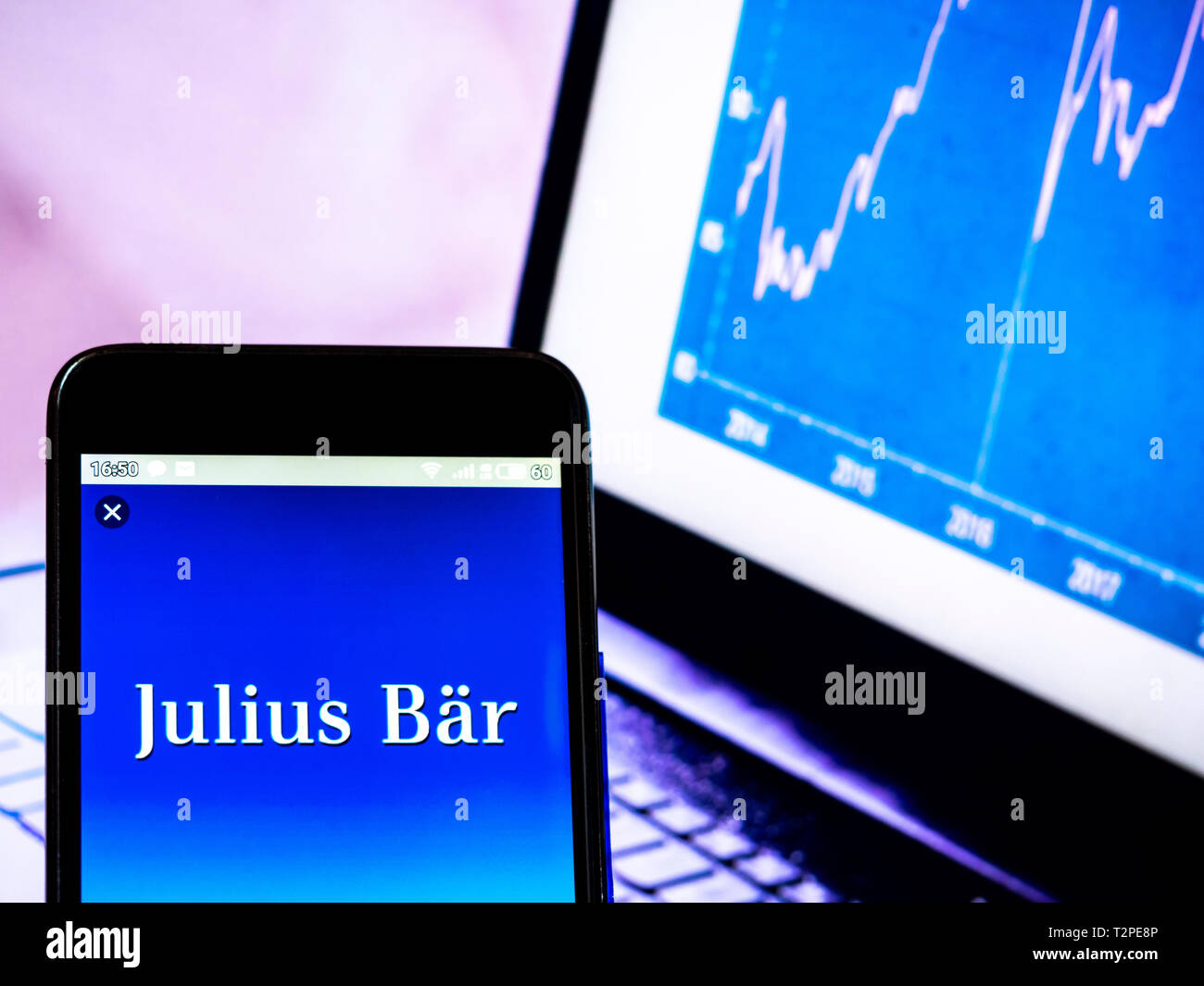 In this photo illustration a Julius Bar Group logo seen displayed on a ...