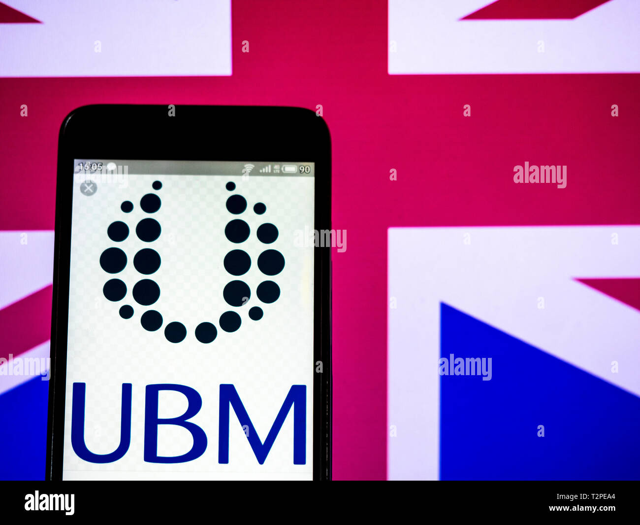 In this photo illustration a UBM plc logo seen displayed on a smart ...