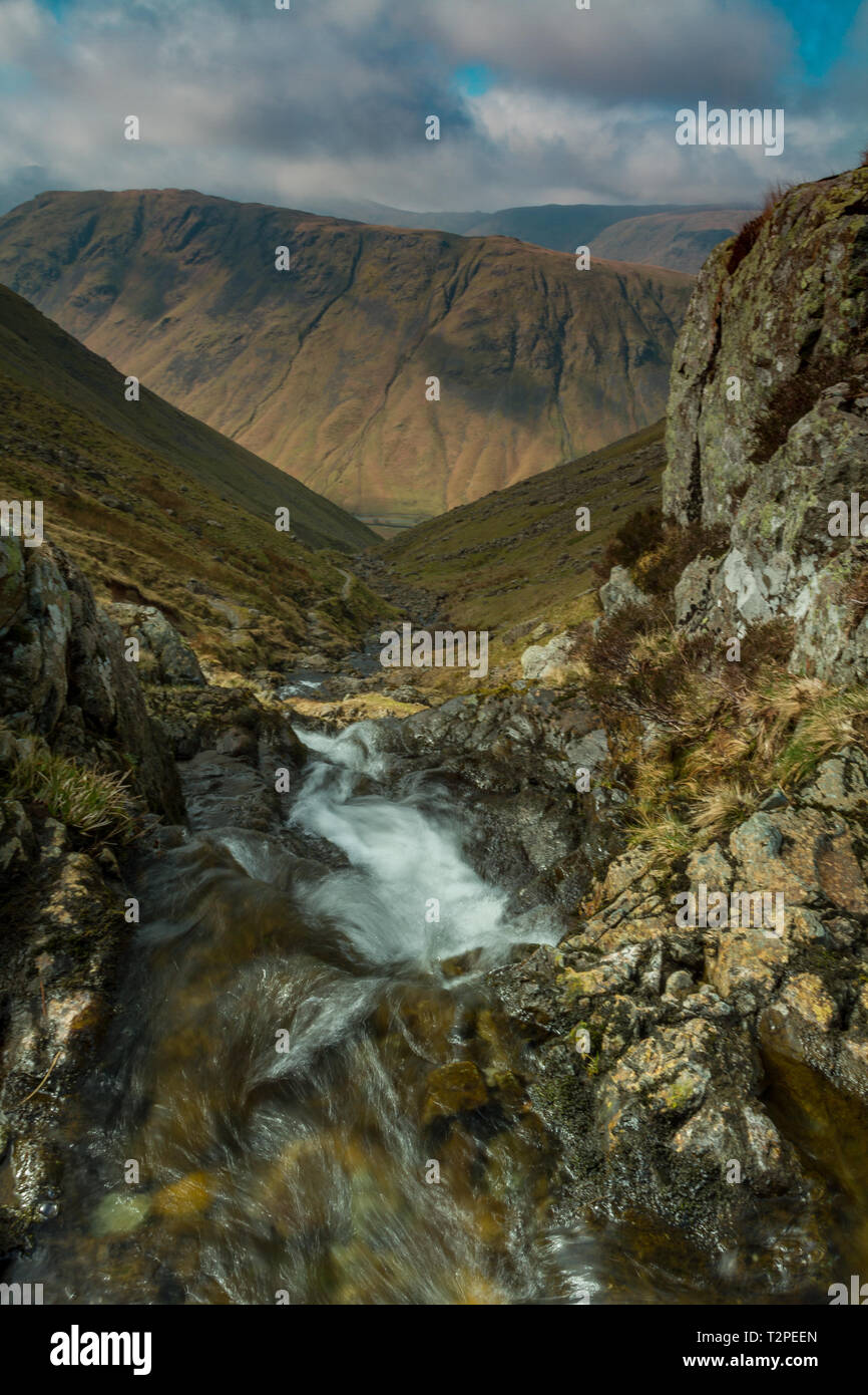 Raise Beck and waterfall, with views across to Steel Fell, Cumbria ...