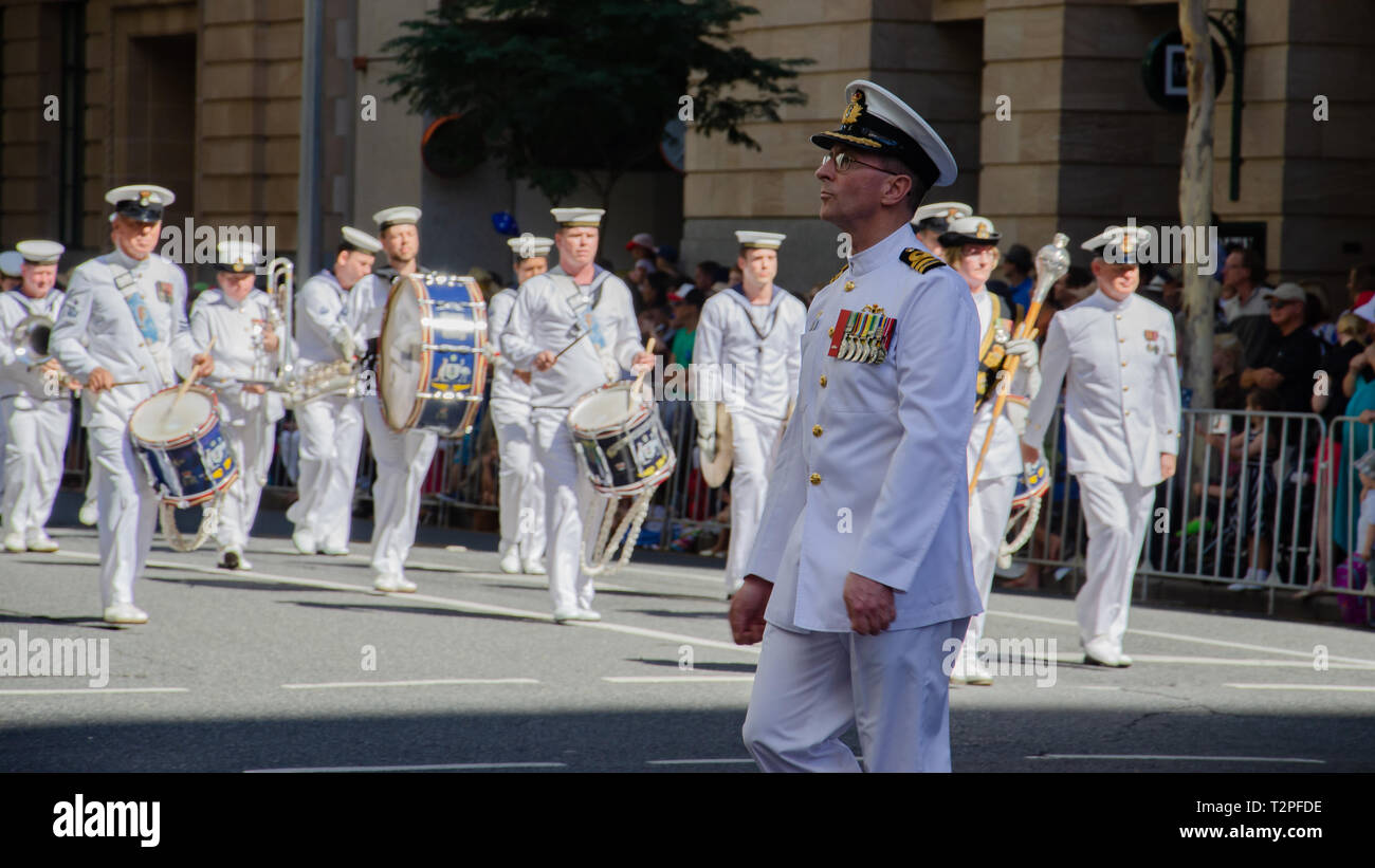 Brisbane hosts an Anzac Day parade. Here a proud navy officer matches ...