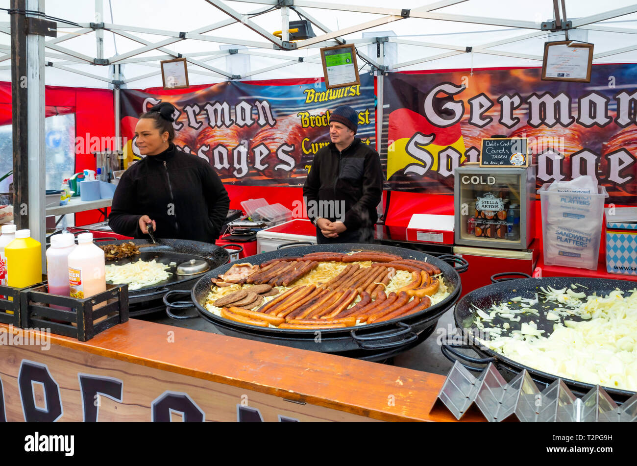 Stall selling German food with several varieties of sausage from a ...