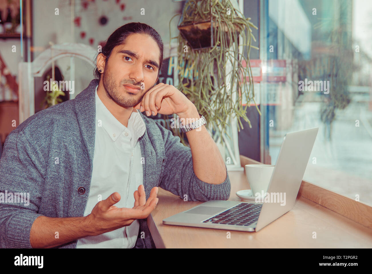 Man looking at you camera frustrated hand gesture in front of the ...