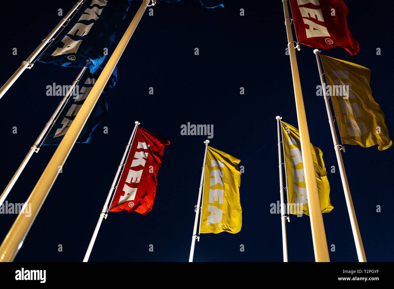 RIGA, LATVIA - APRIL 3, 2019: IKEA flags during dark evening and wind ... RIGA, LATVIA - APRIL 3, 2019: IKEA flags during dark evening and wind ...