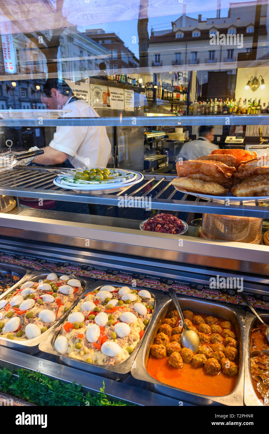 A variety of food dishes seen through the window of a Tapas bar in the ...