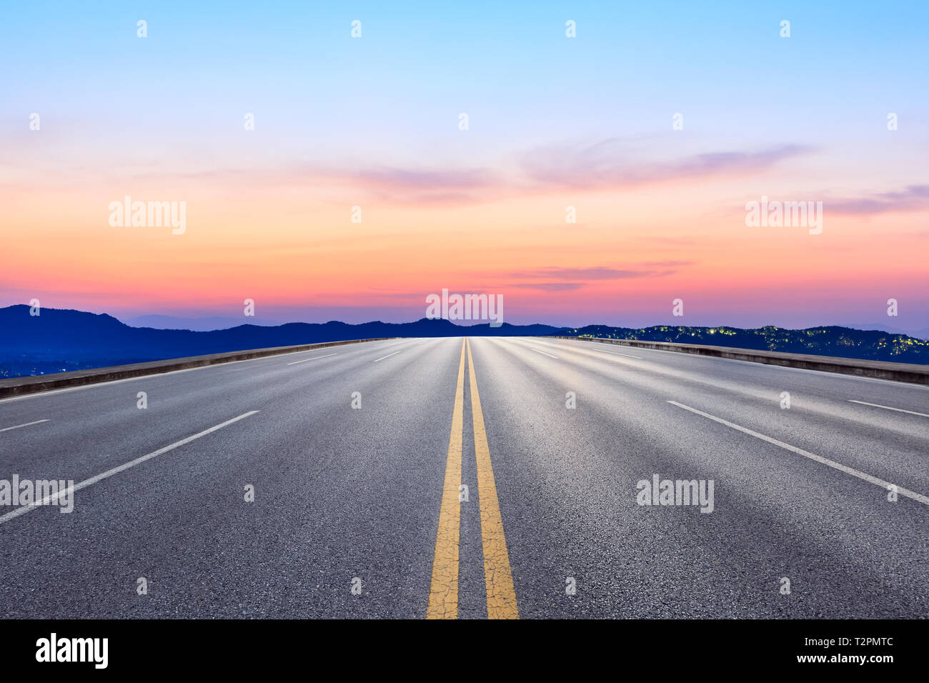Straight road at sunset hi-res stock photography and images - Alamy