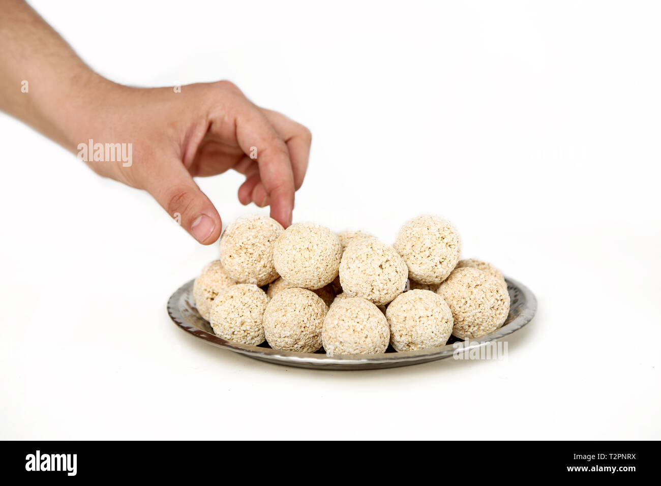 Indian man eating sweet hi-res stock photography and images - Alamy