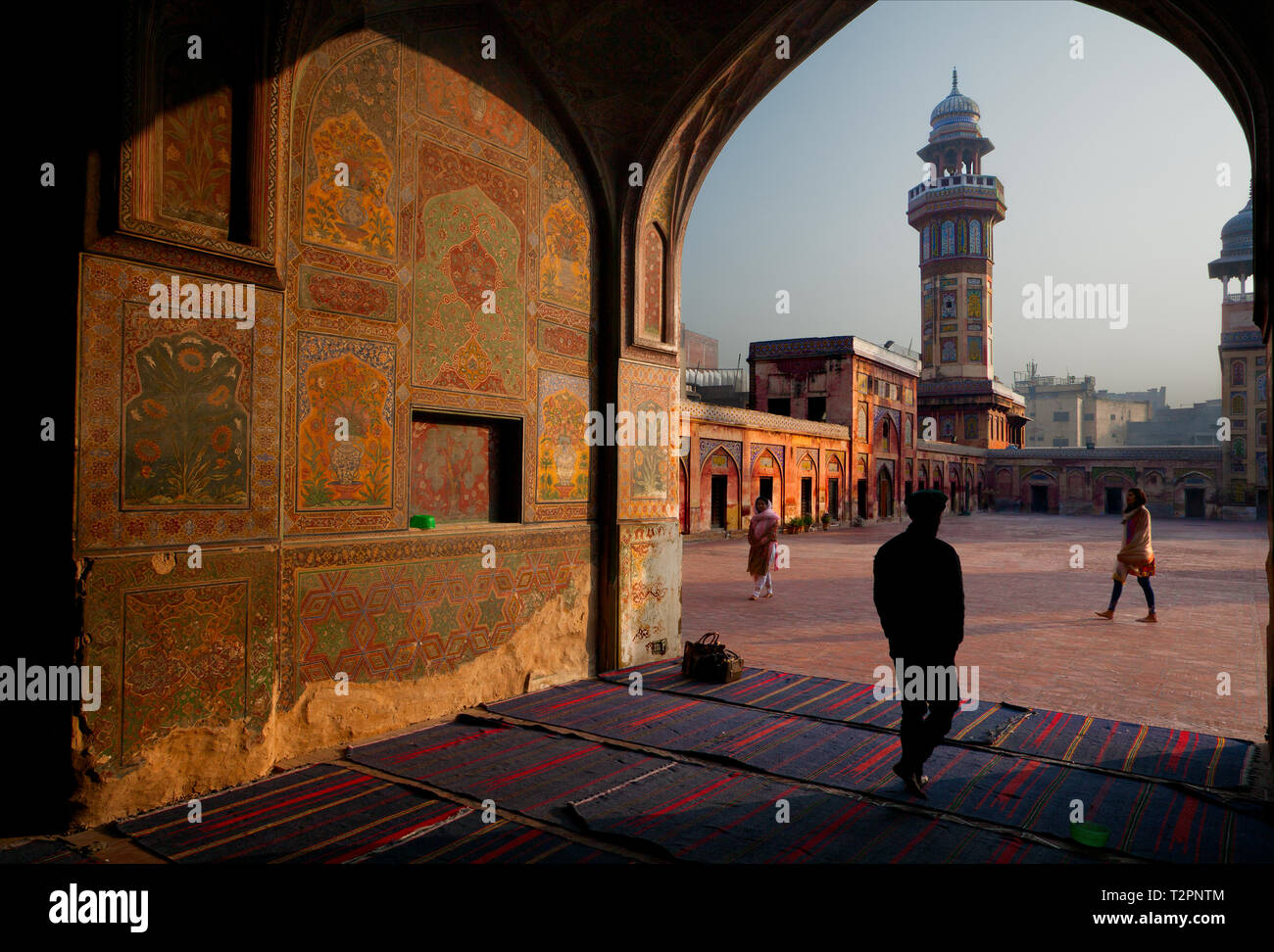 Early morning light strikes on hand painted wall of Masjid Wazir Khan, Lahore. 16th century ...