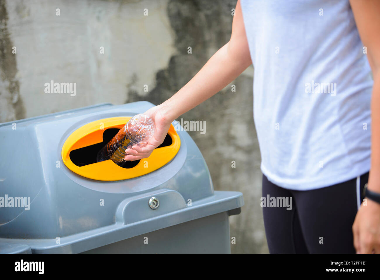Woman throwing plastic bottle away hi-res stock photography and images ...