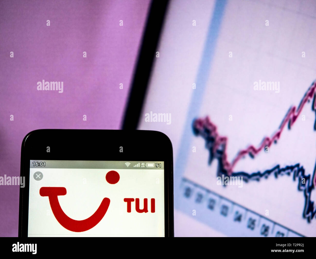 In this photo illustration a TUI Group logo seen displayed on a smart ...