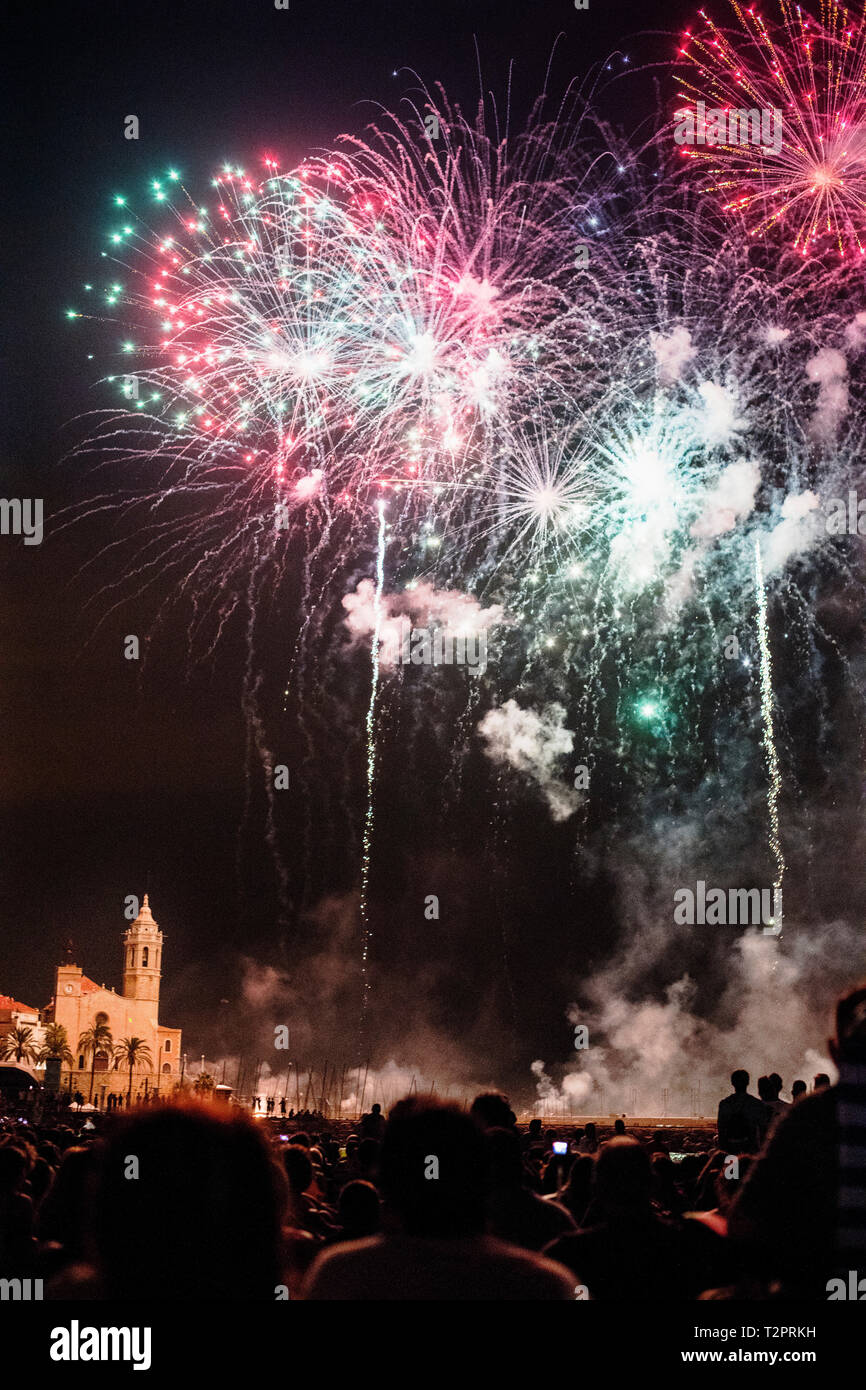 Group of people watching fireworks display at night Stock Photo - Alamy